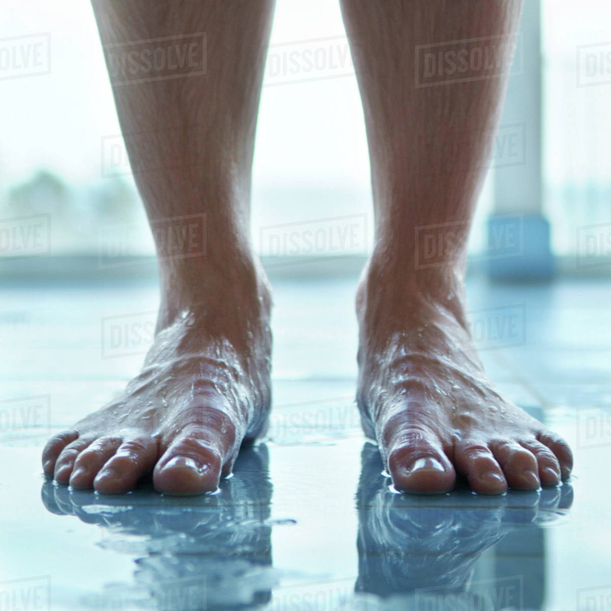 Feet on the edge of the pool - Royalty-free Stock Photo | Dissolve