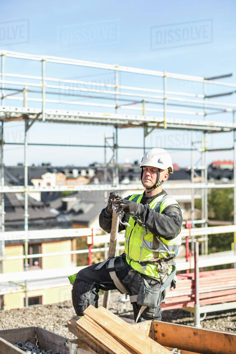 Construction worker working at site - Royalty-free Stock Photo | Dissolve