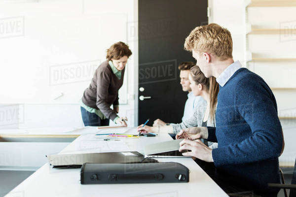 Professor teaching students in classroom - Royalty-free Stock Photo ...