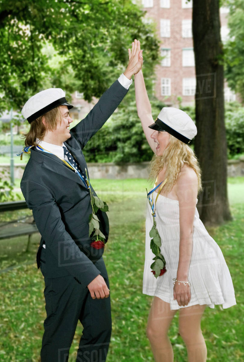 Students doing high five - Royalty-free Stock Photo | Dissolve