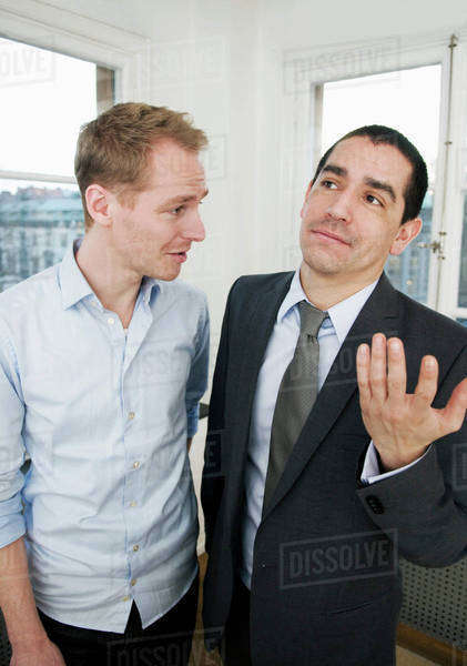 Two men discussing - Royalty-free Stock Photo | Dissolve