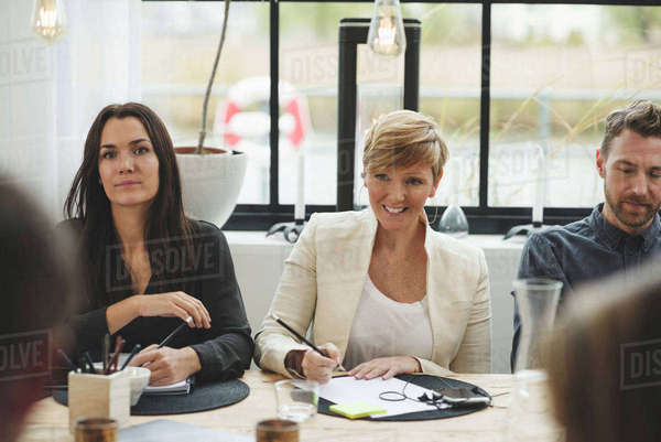 Smiling business people taking interview in office - Royalty-free Stock ...