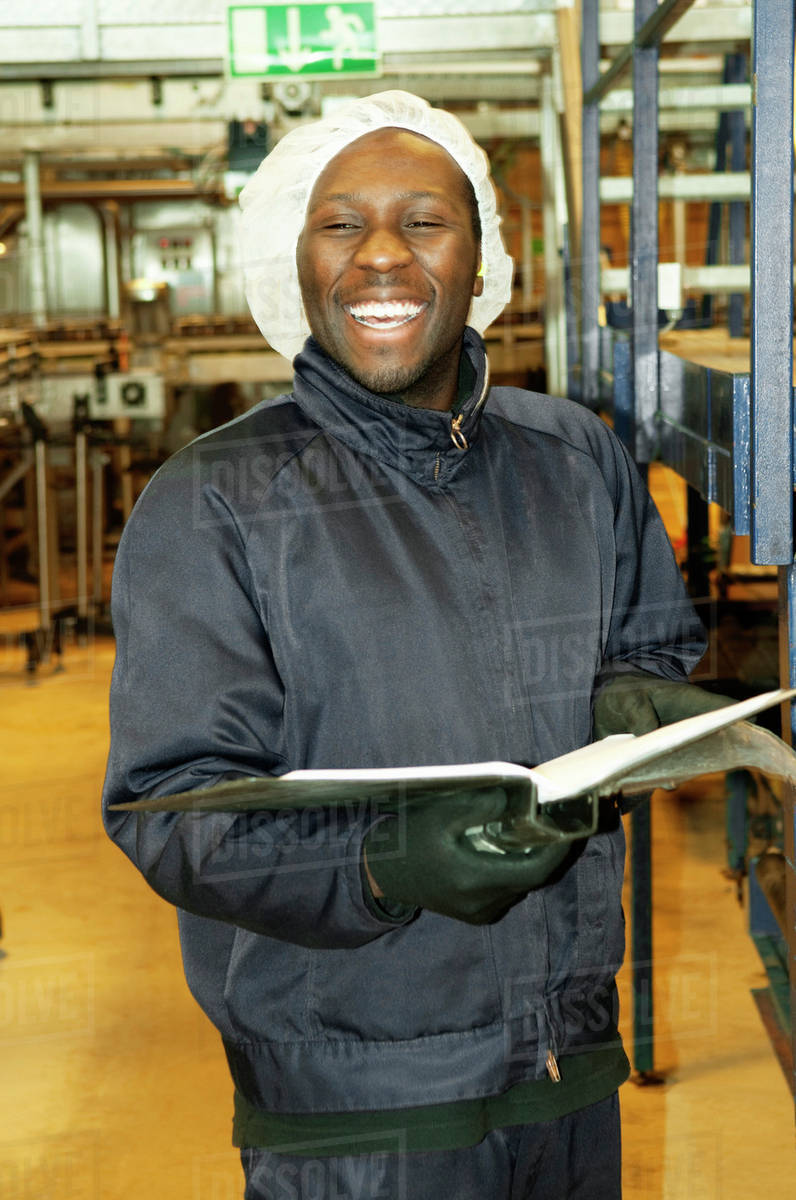 Worker checking file folders - Royalty-free Stock Photo | Dissolve