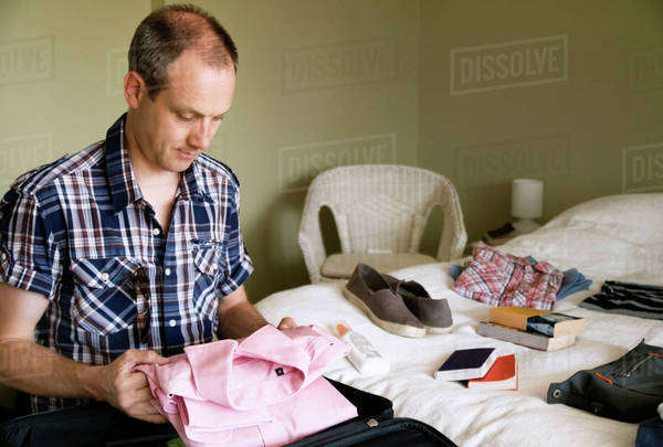 Man packs - Royalty-free Stock Photo | Dissolve