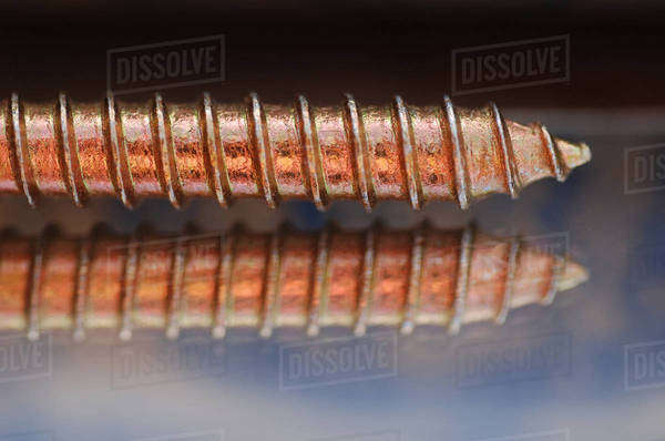 Screw in reflection - Stock Photo - Dissolve