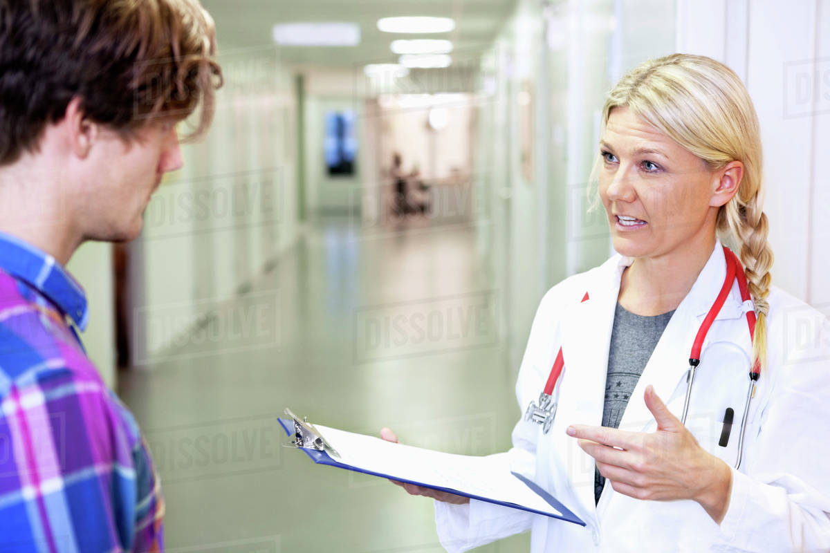 Doctor speaking to patient - Royalty-free Stock Photo | Dissolve