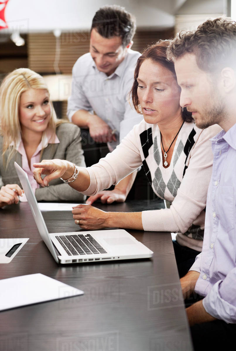 Four people at work - Royalty-free Stock Photo | Dissolve