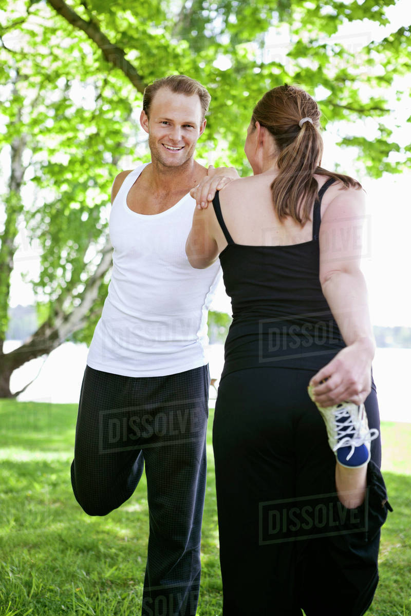 Two people stretching - Royalty-free Stock Photo | Dissolve