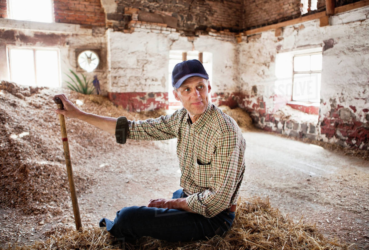 Man in barn - Royalty-free Stock Photo | Dissolve