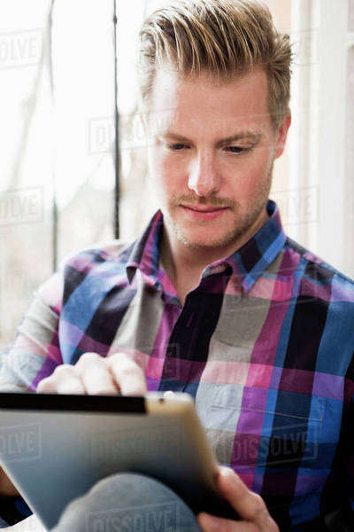Guy surfing the internet - Royalty-free Stock Photo | Dissolve