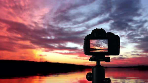 Digital camera sunset photography - Stock Video Footage - Dissolve