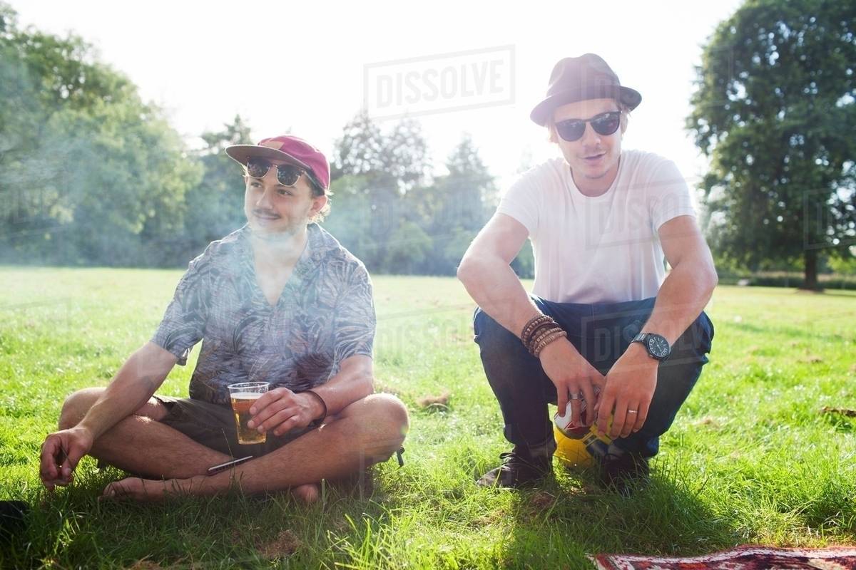 Portrait of two cool male friends at park party - Royalty-free Stock ...