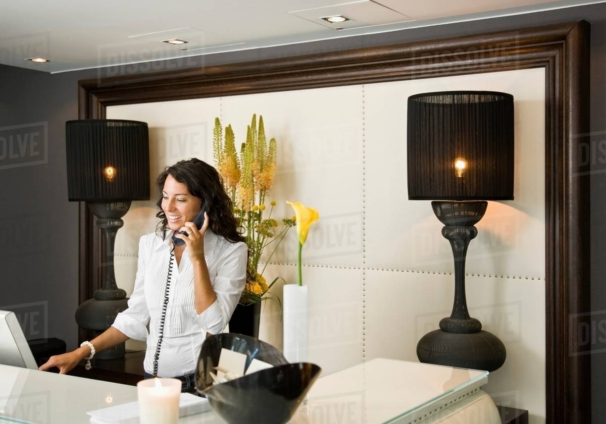 Female receptionist talking on the phone - Royalty-free Stock Photo ...