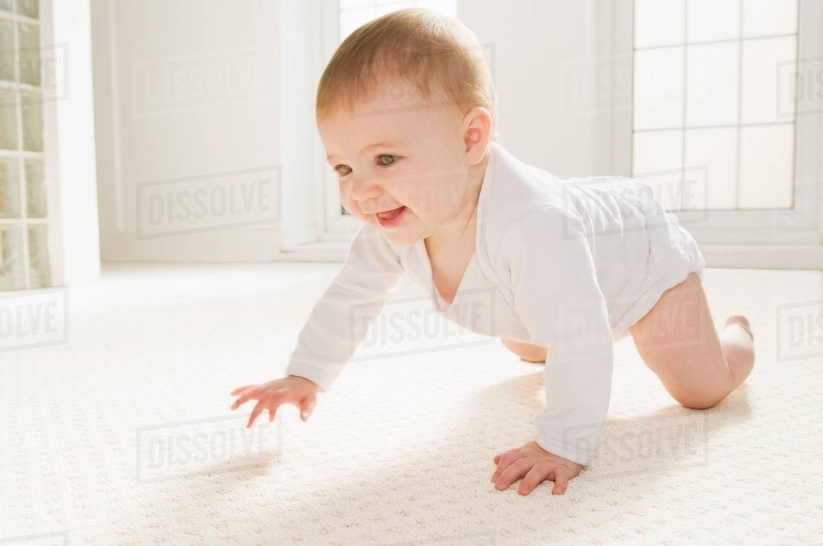 A baby crawling - Royalty-free Stock Photo | Dissolve