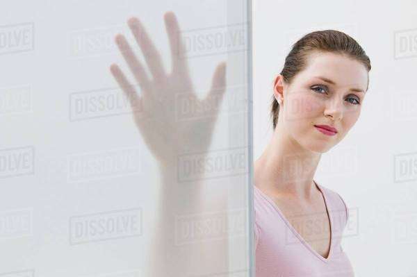 A female with her hand on a screen - Royalty-free Stock Photo | Dissolve