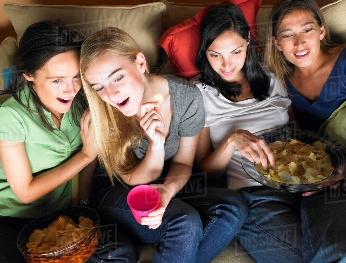 Women watching television - Stock Photo - Dissolve
