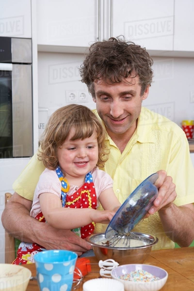 Father and daughter, preparing dessert - Royalty-free Stock Photo ...