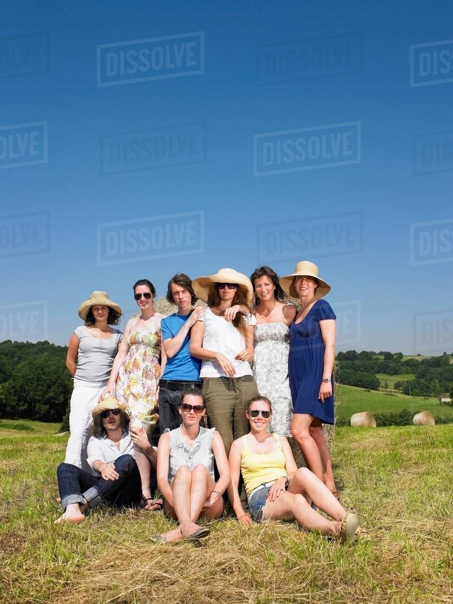 Group of friends in field - Royalty-free Stock Photo | Dissolve
