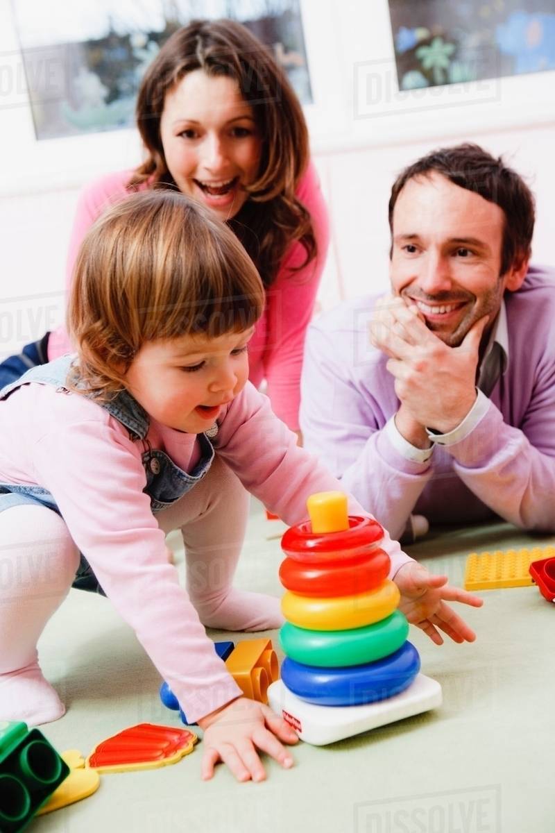 Family playing together - Stock Photo - Dissolve