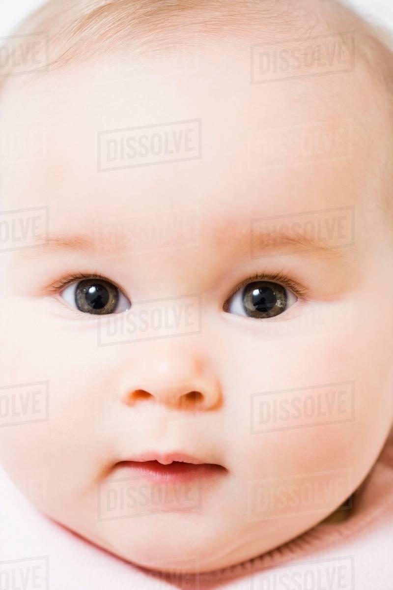 Baby looking to camera close-up - Royalty-free Stock Photo | Dissolve