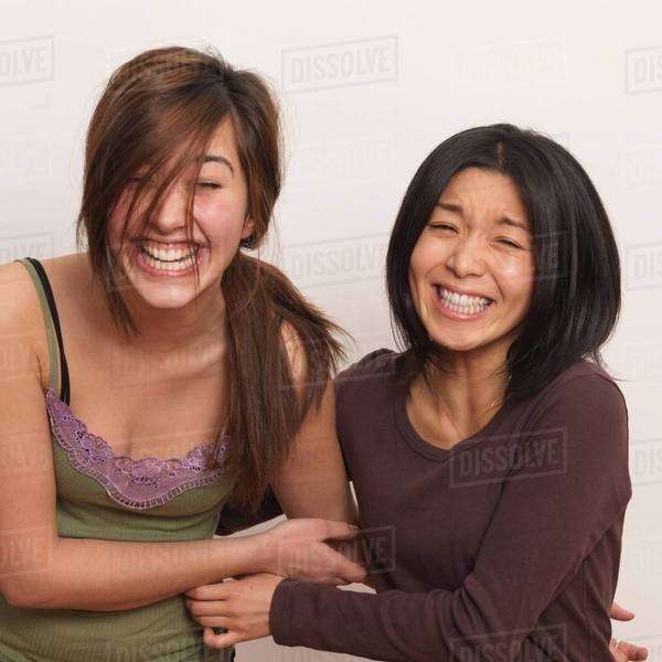 Two women laughing - Stock Photo - Dissolve