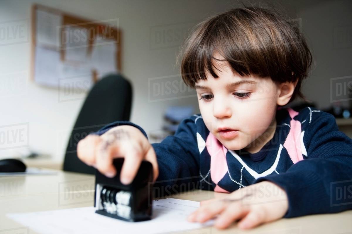 Young boy with stamp - Royalty-free Stock Photo | Dissolve