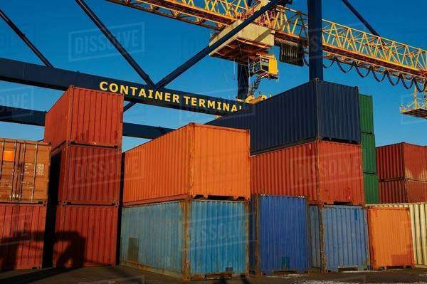 Containers in stacks at port - Stock Photo - Dissolve