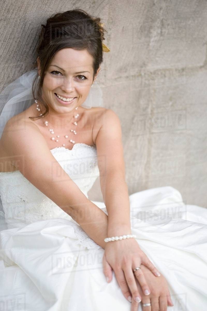 Bride smiling at the camera. - Stock Photo - Dissolve
