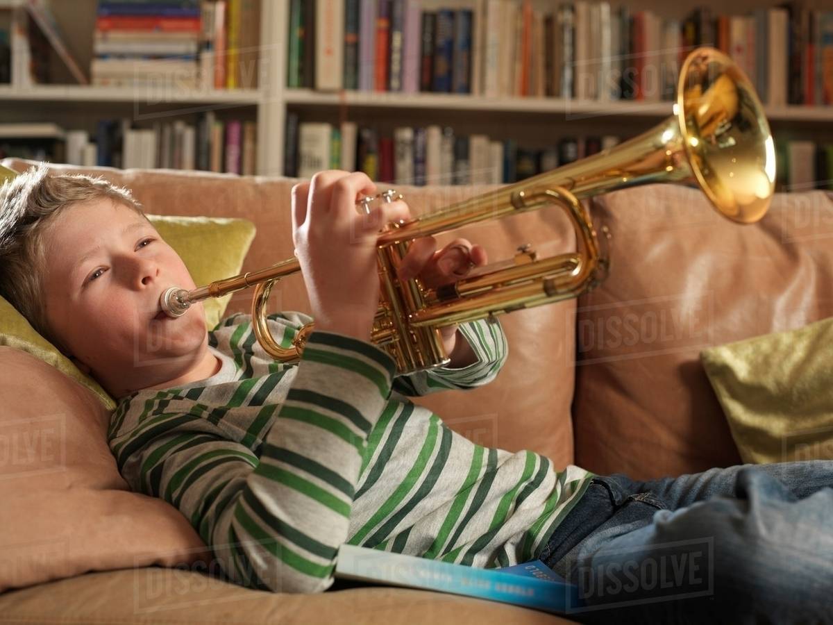 Boy, 11 playing trumpet - Royalty-free Stock Photo | Dissolve