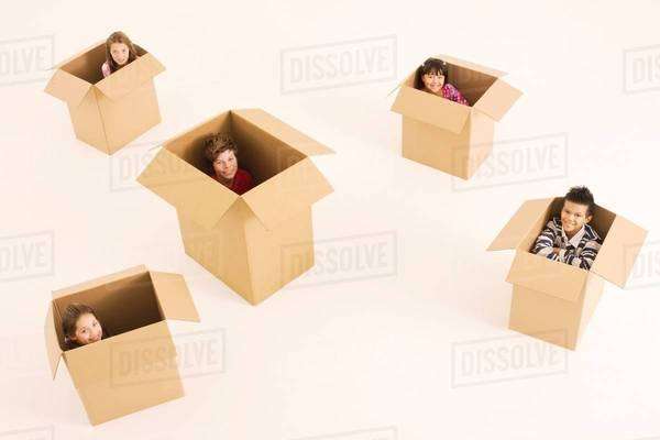 Children sitting in boxes - Royalty-free Stock Photo | Dissolve