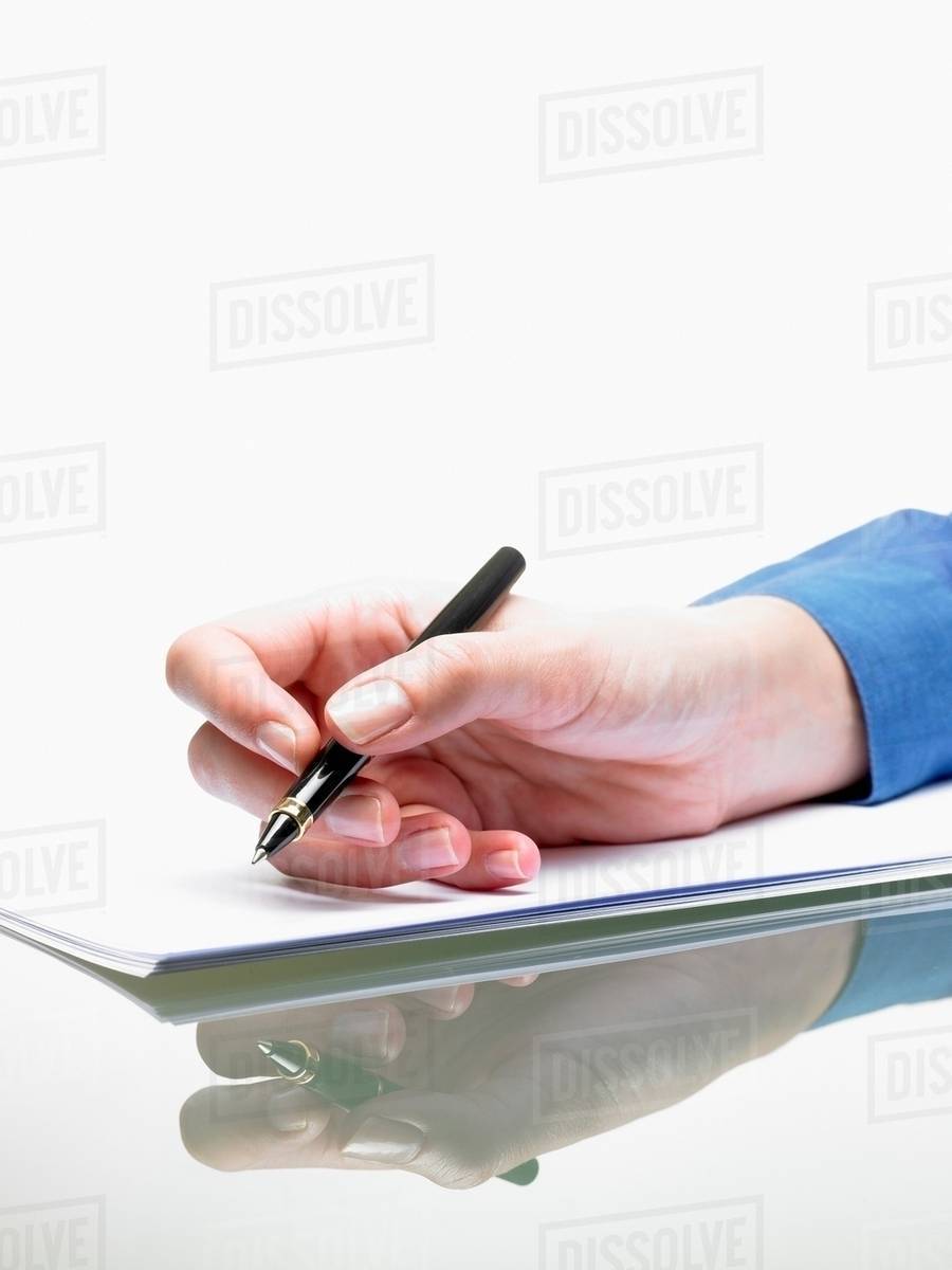 Hand of a woman, writing - Stock Photo - Dissolve