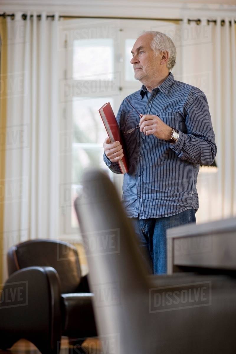 Old man with book - Royalty-free Stock Photo | Dissolve
