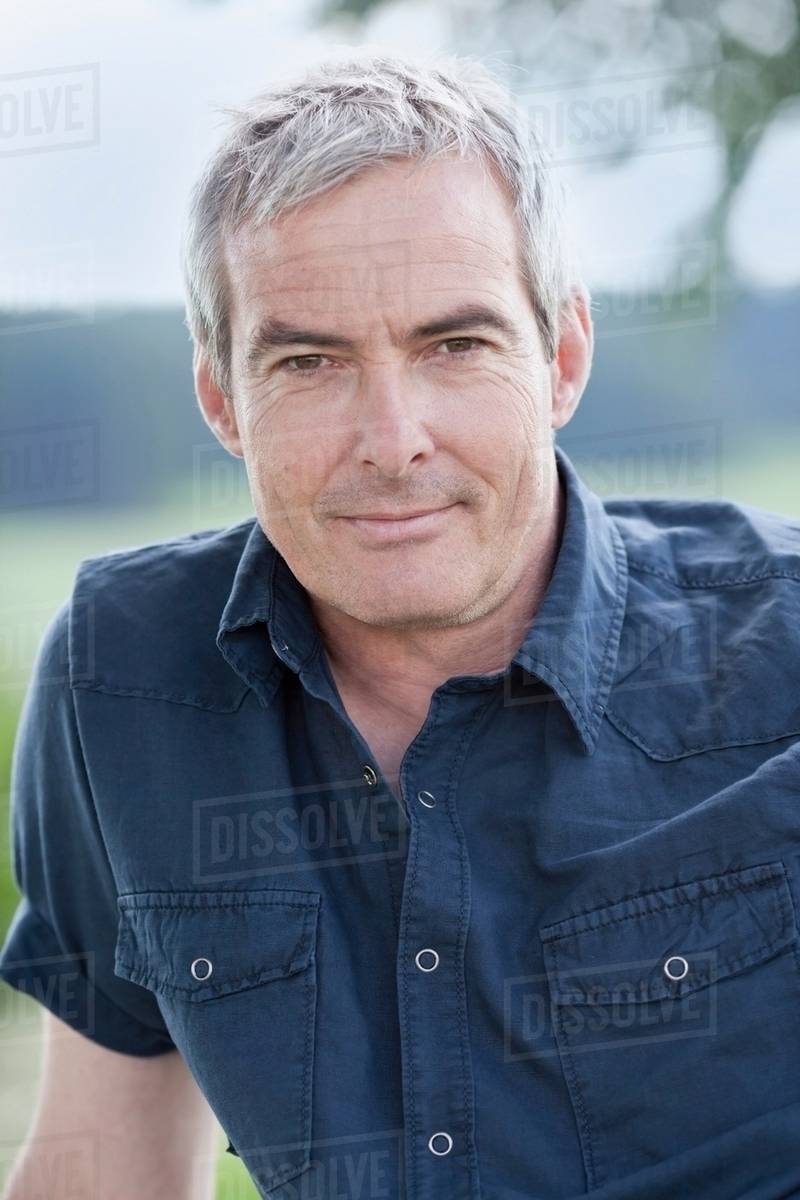 Man sitting smiling at viewer - Royalty-free Stock Photo | Dissolve