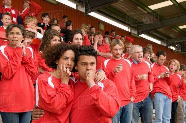 Nervous fans at football match - Royalty-free Stock Photo | Dissolve