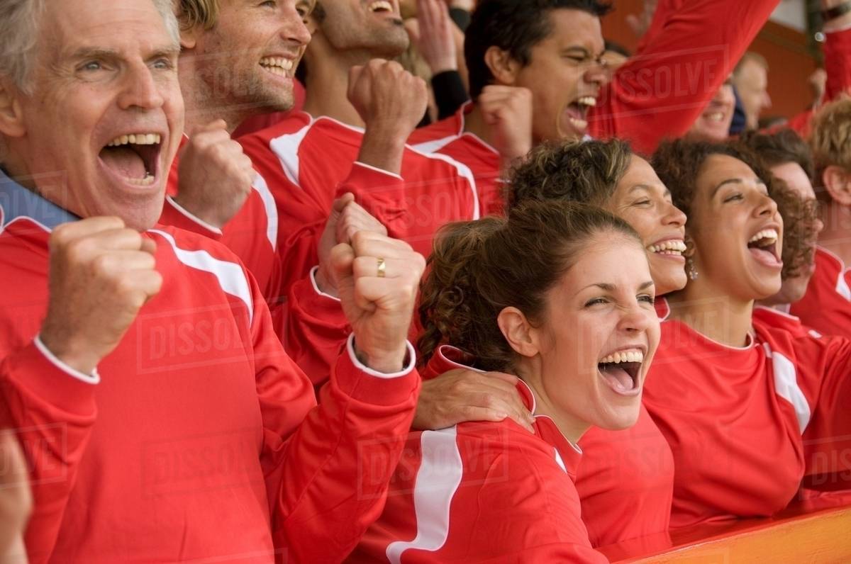 Fans celebrating at football match - Royalty-free Stock Photo | Dissolve