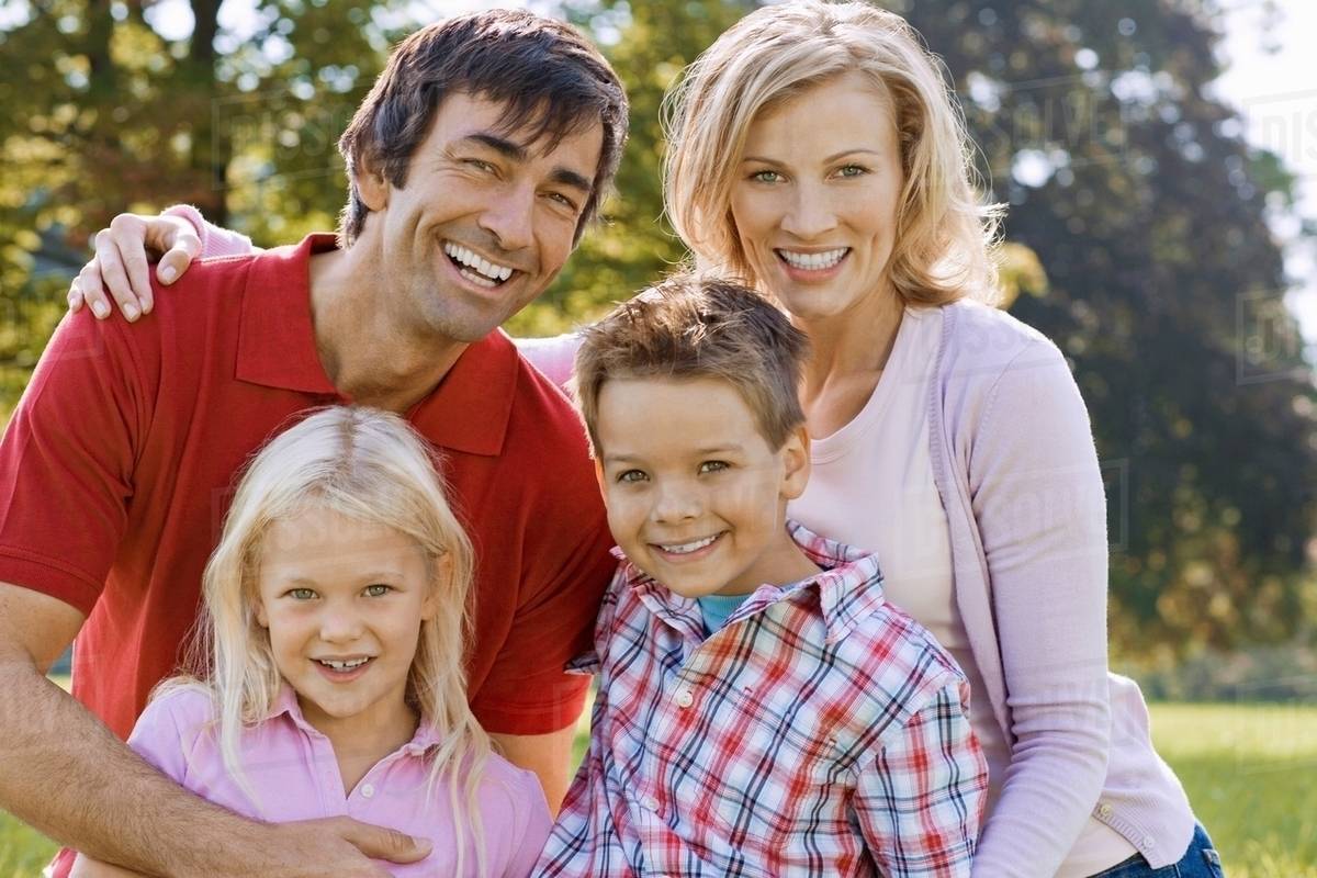 A family portrait in the park - Stock Photo - Dissolve