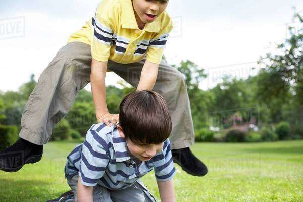 Kids playing in garden - Royalty-free Stock Photo | Dissolve