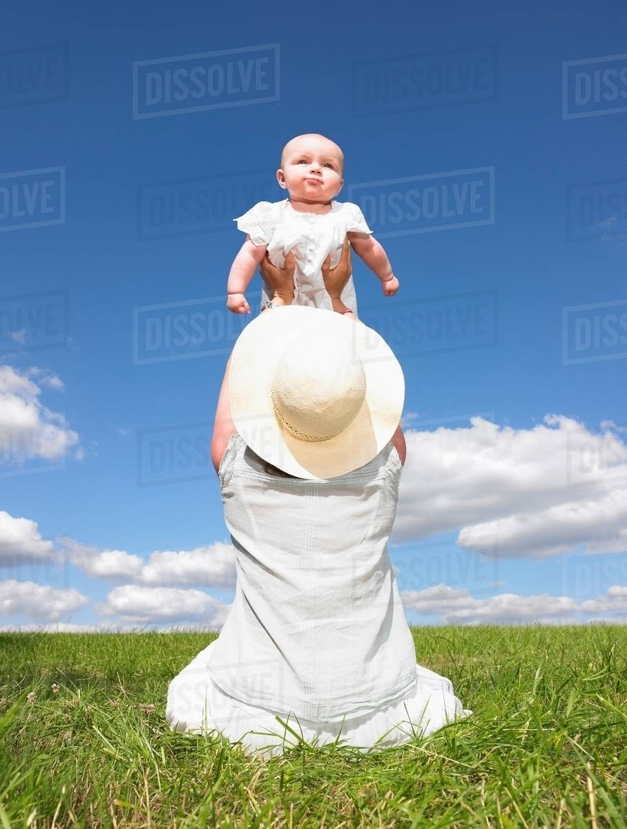 Mother and baby in field - Royalty-free Stock Photo | Dissolve