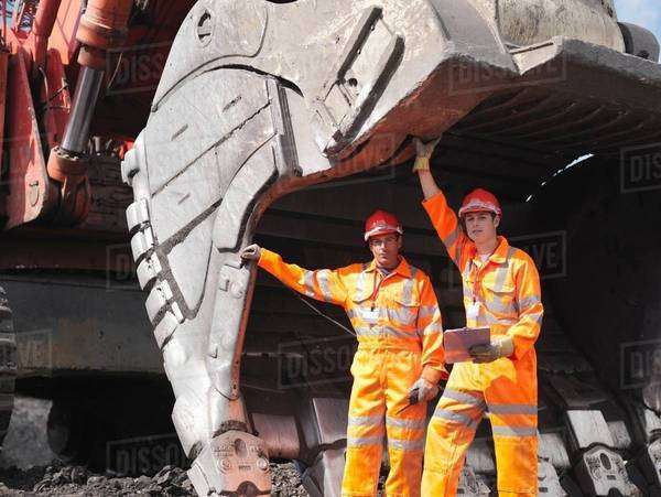 Coal Miners With Digger - Stock Photo - Dissolve