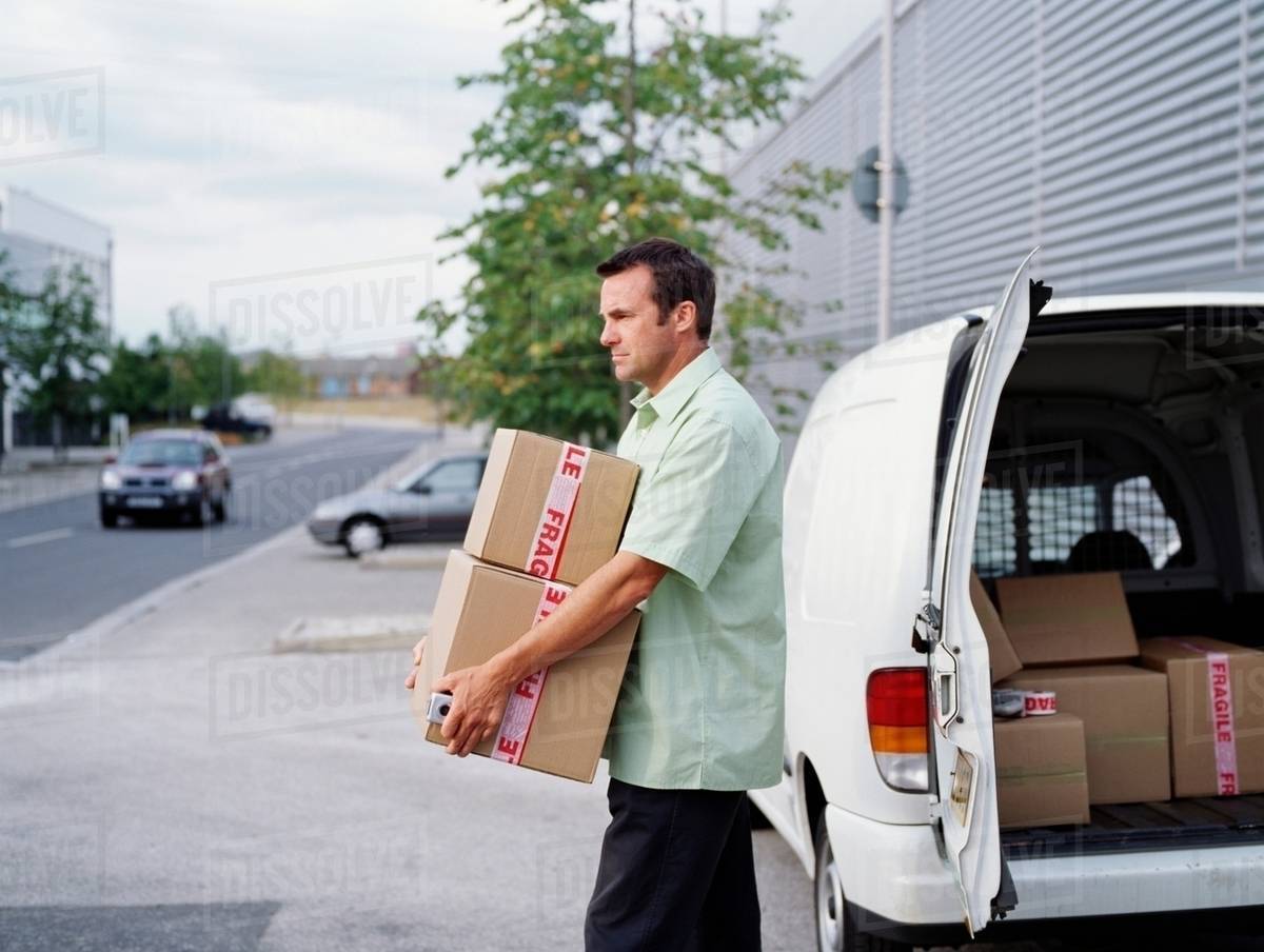 A courier delivers parcels - Royalty-free Stock Photo | Dissolve