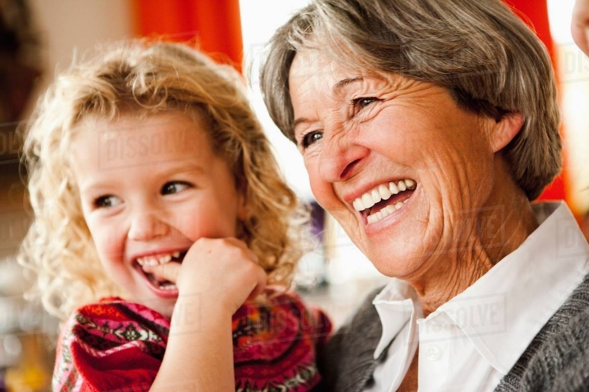 Grandma and grandchildren laughing - Royalty-free Stock Photo | Dissolve