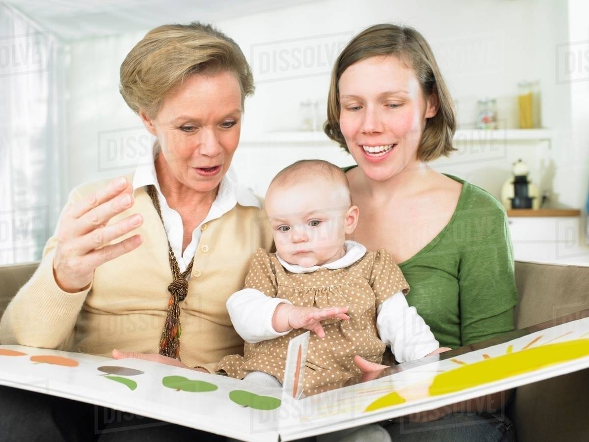 Family reading book - Royalty-free Stock Photo | Dissolve