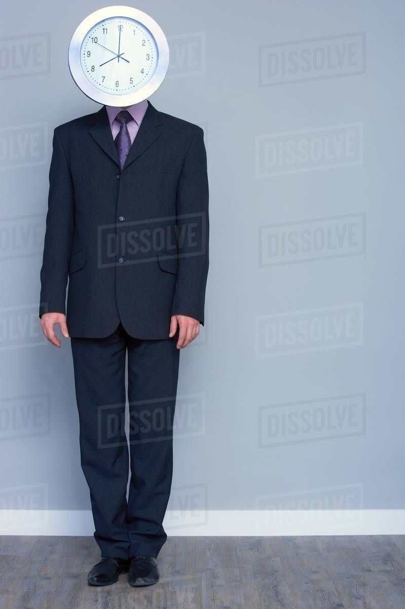 Man in a suit with a clock head - Royalty-free Stock Photo | Dissolve