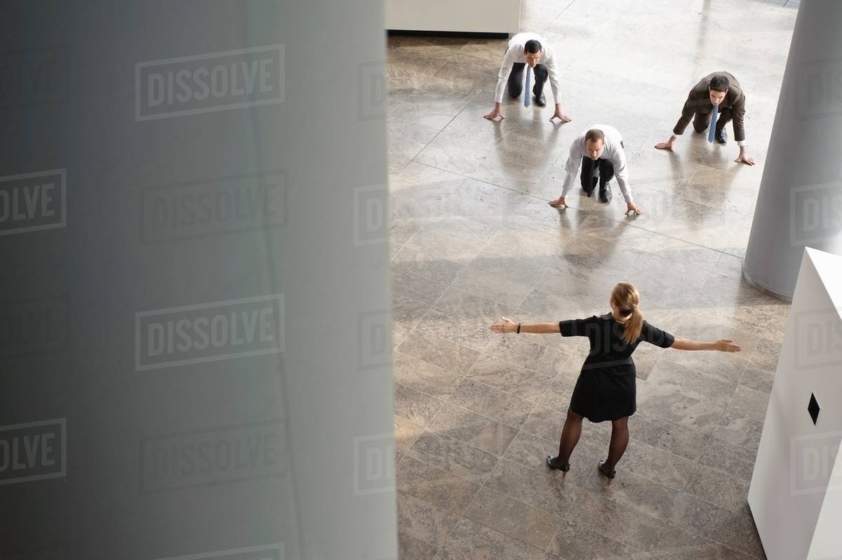 Business men at start position waiting - Stock Photo - Dissolve