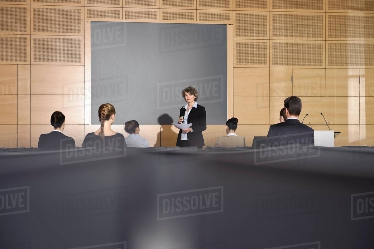 Business people in seminar - Stock Photo - Dissolve
