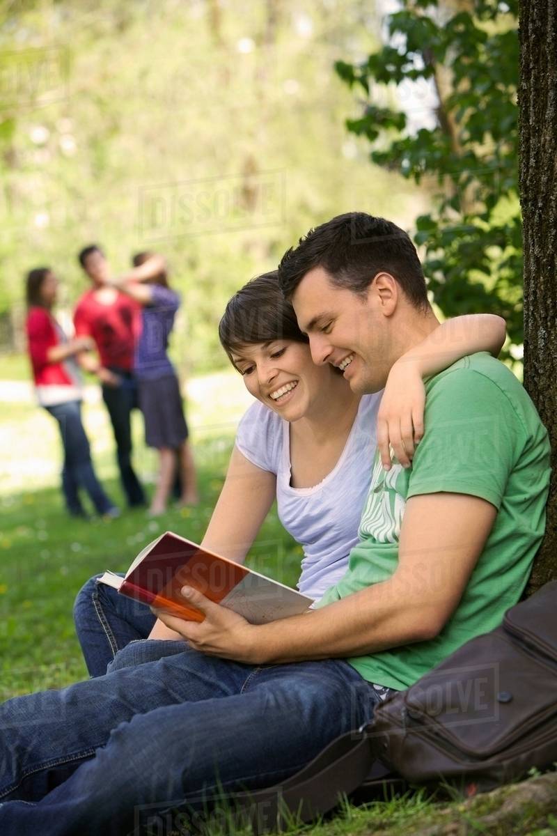 Students studying outdoors - Stock Photo - Dissolve