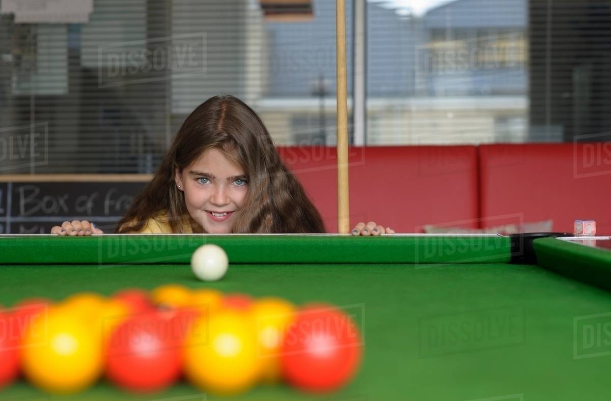 Young girl playing pool - Royalty-free Stock Photo | Dissolve