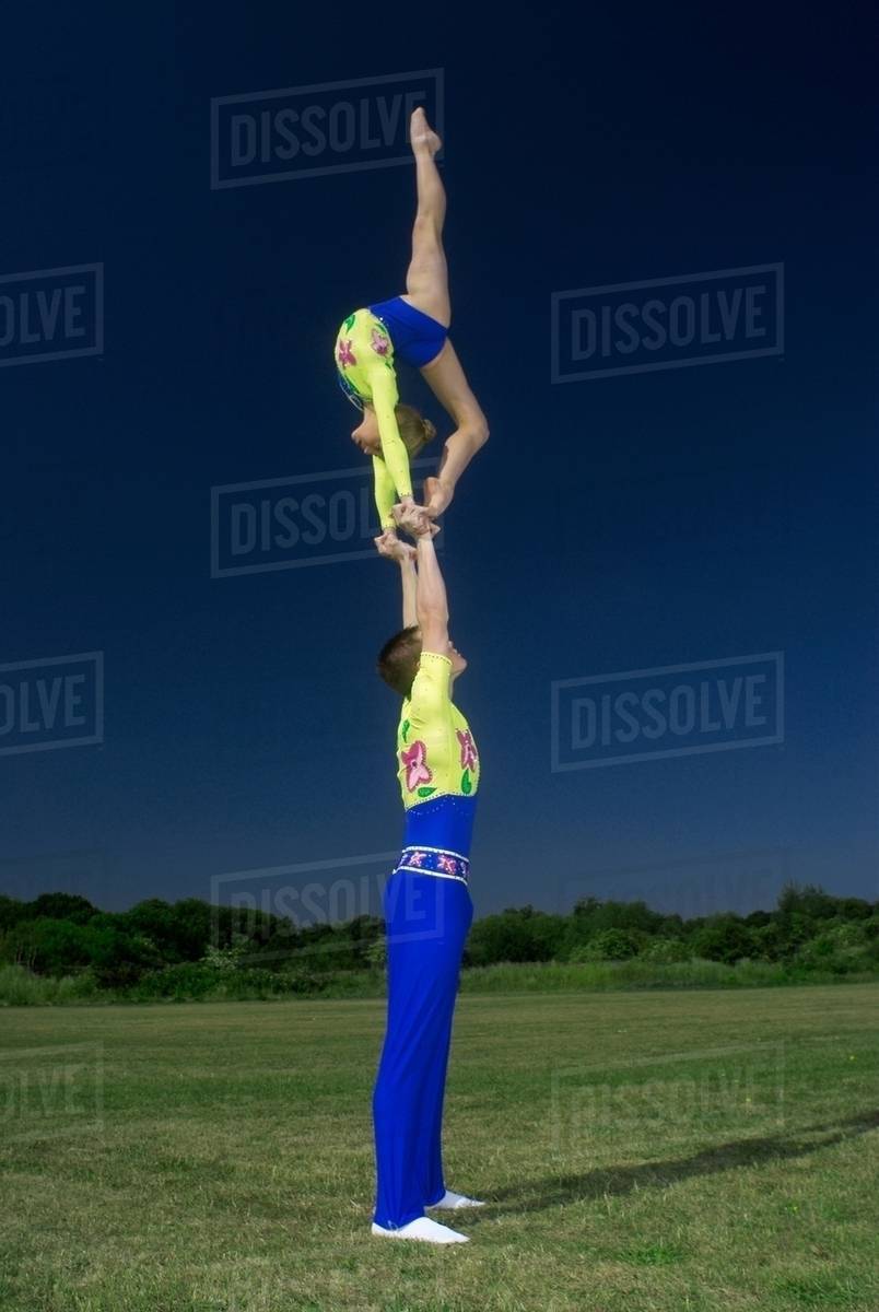 Acrobatic troop performing moves - Royalty-free Stock Photo | Dissolve