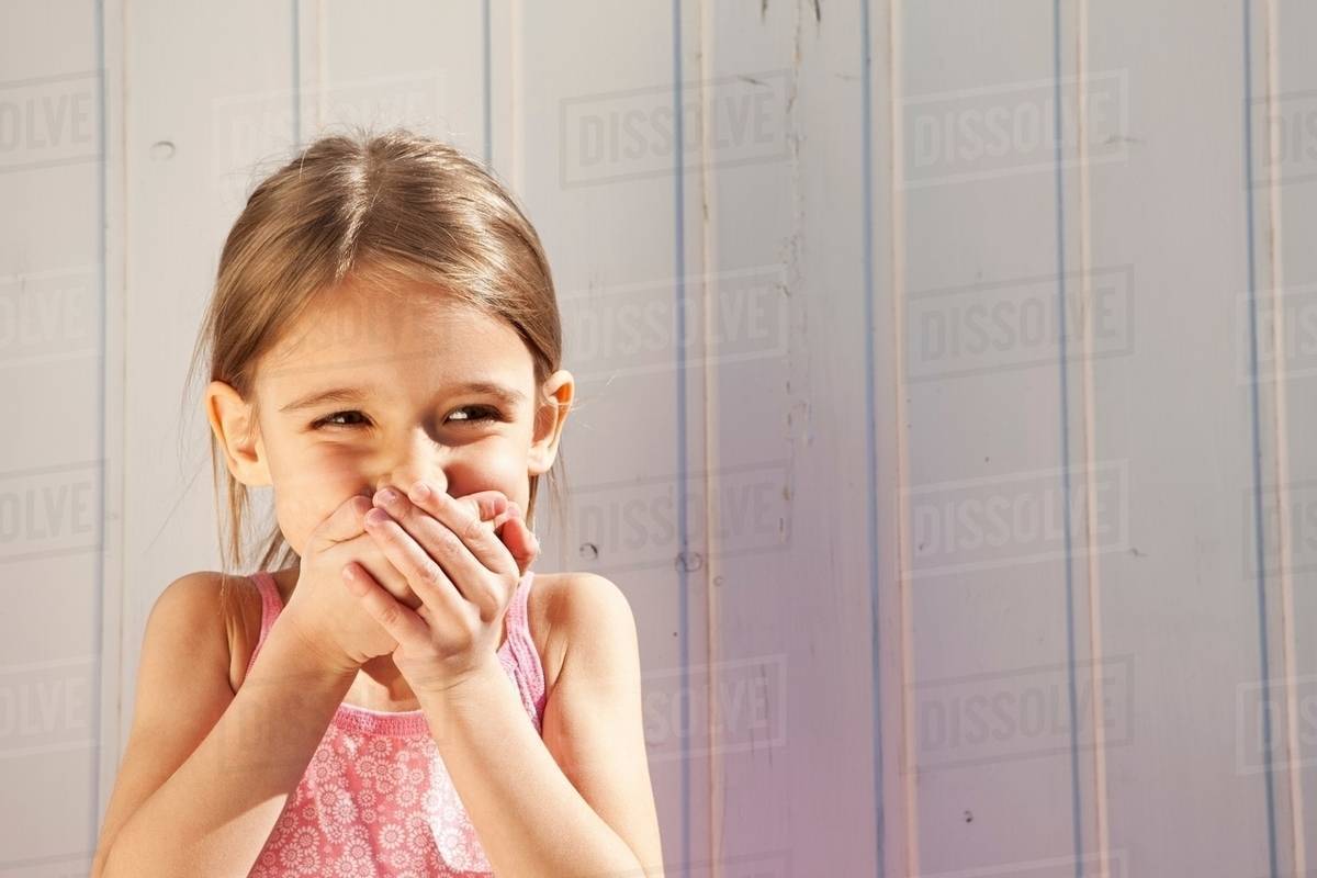 Little Girl giggling - Royalty-free Stock Photo | Dissolve