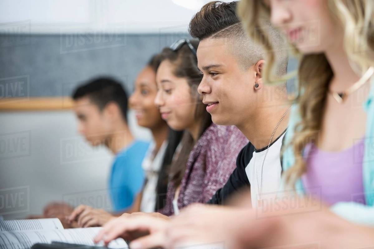 Row of teenage high school students in computer class - Royalty-free ...